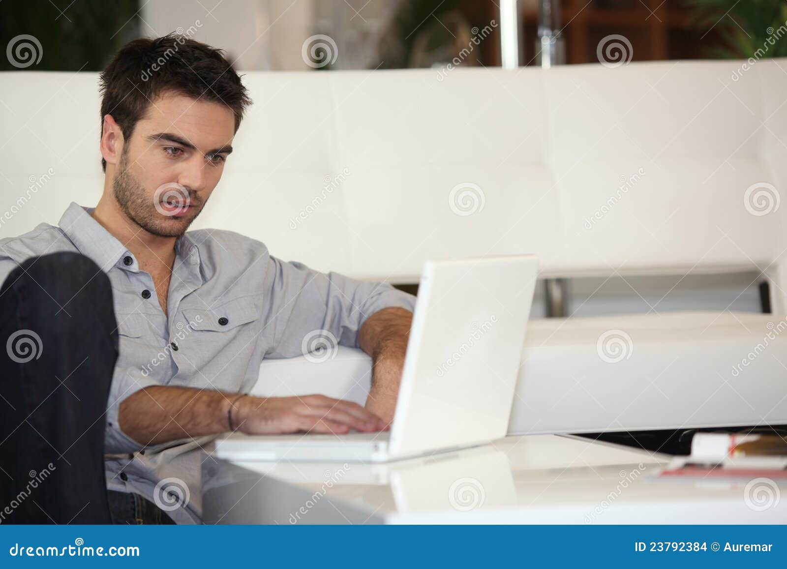 Man checking his emails stock photo. Image of room, check - 23792384