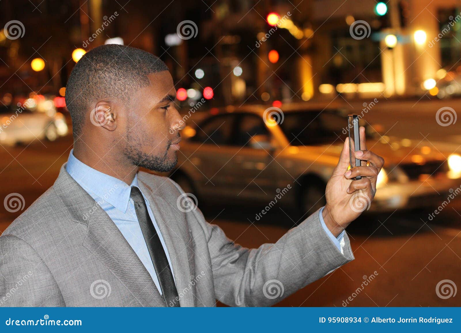 Man Checking His Phone in the City Streets Stock Photo - Image of ...