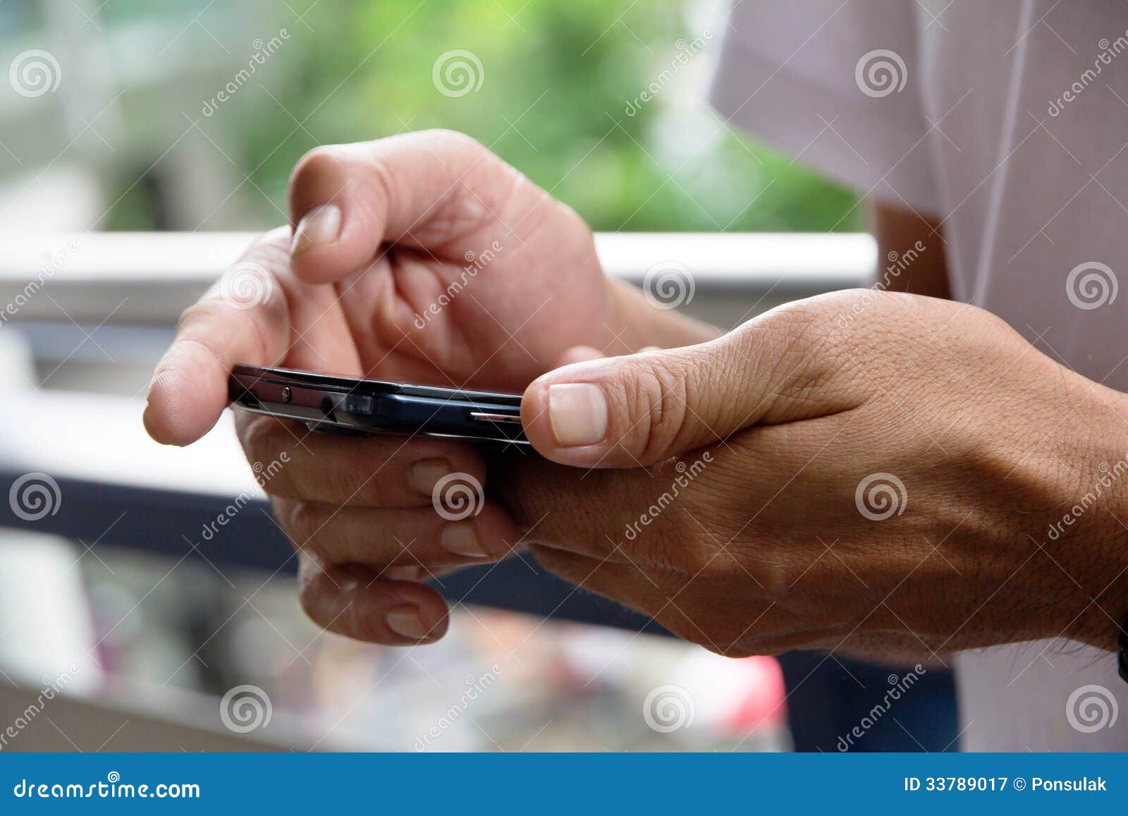 Man checking his phone stock image. Image of adult, outdoor - 33789017
