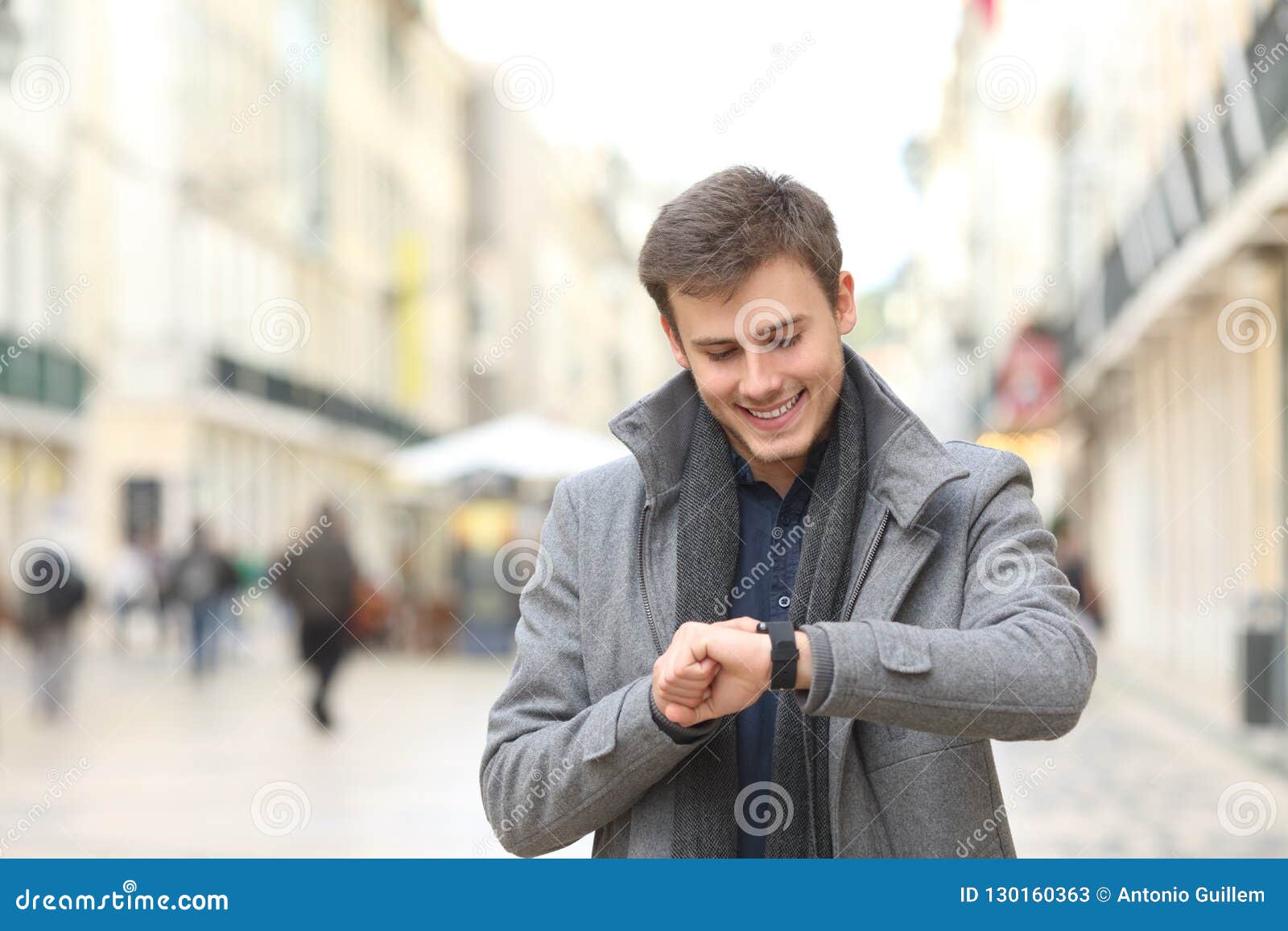 Man Checking His Smart Watch in the Street Stock Image - Image of ...