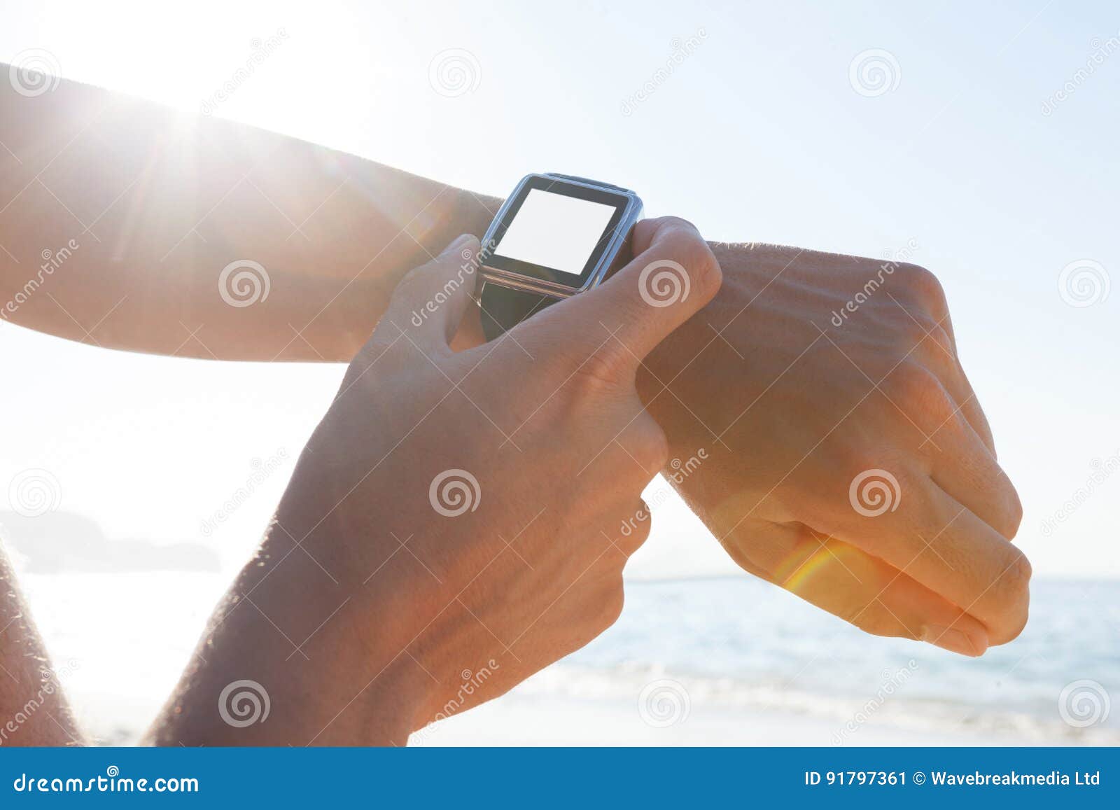 Man Checking His Smartwatch on the Beach Stock Image - Image of freedom ...