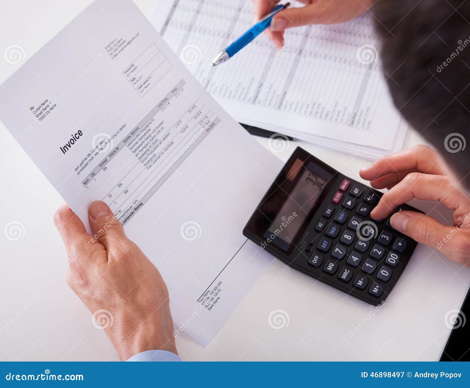 Man Checking an Invoice on a Calculator Stock Image - Image of ...