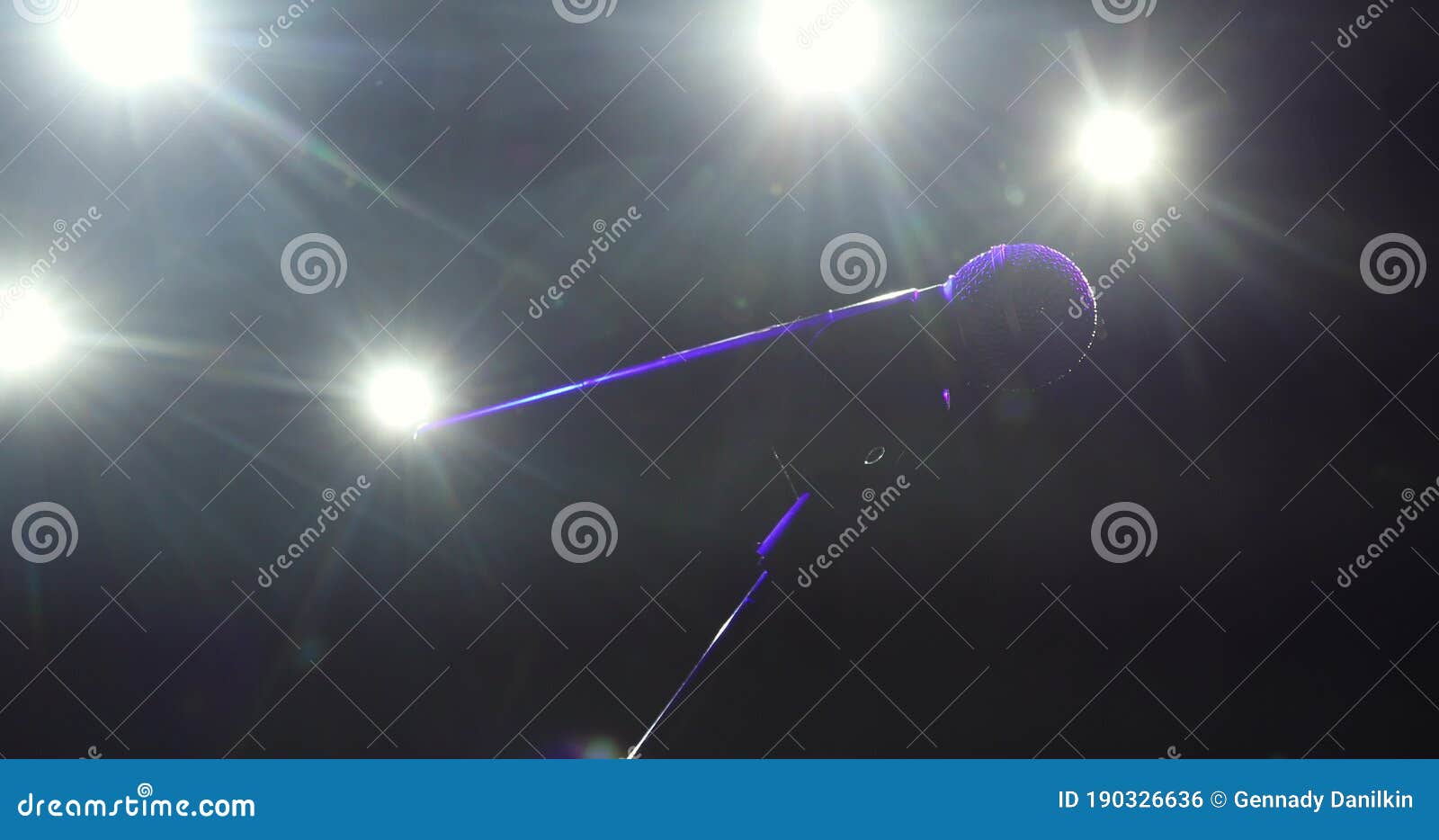 Hand of Man Testing Microphone on Stage in Spotlight Preparing To ...