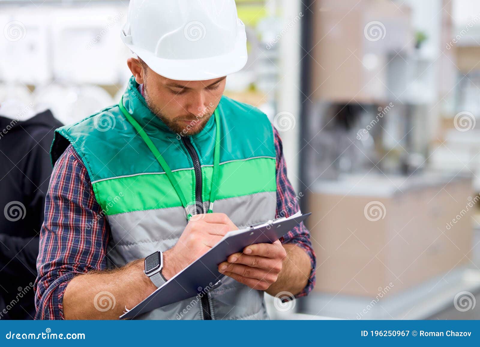 Man is Checking Supplies on Document with an Engrossed Expression in ...