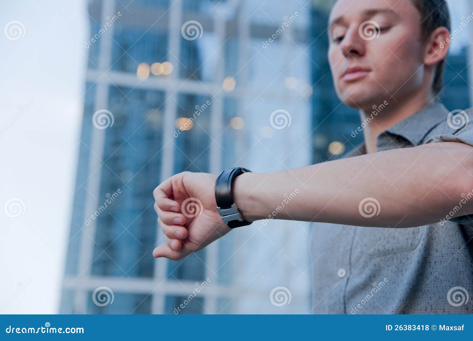 Man checking the time stock photo. Image of business - 26383418