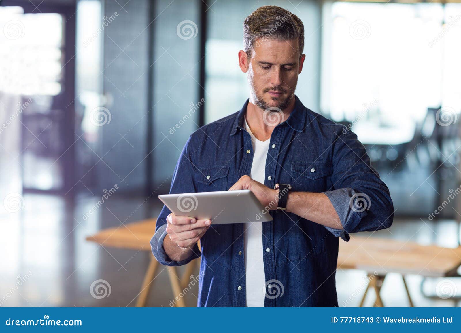 Man Checking Time while Holding Tablet Stock Image - Image of holding ...