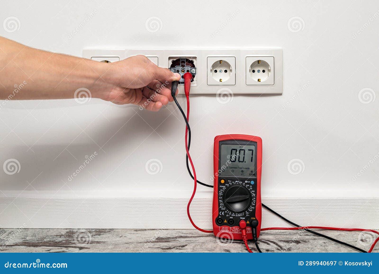 Man Checking the Voltage of Electricity at a Home Outlet Stock Image ...