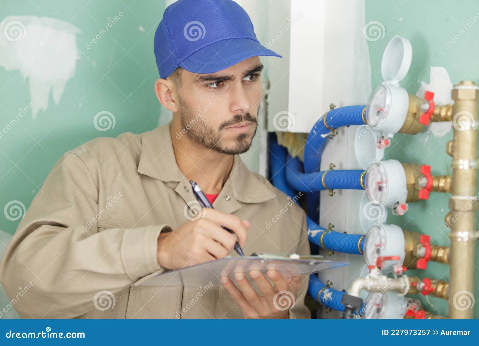 Man checking water meter stock image. Image of view - 227973257