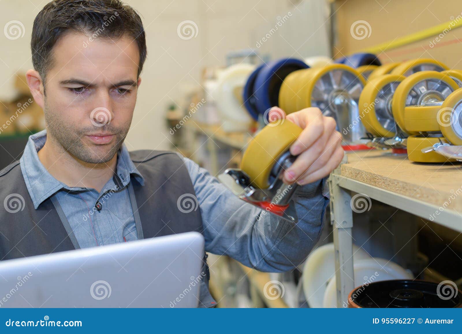 Man Checking Wheel Stock in Computer Stock Image - Image of mechanic ...