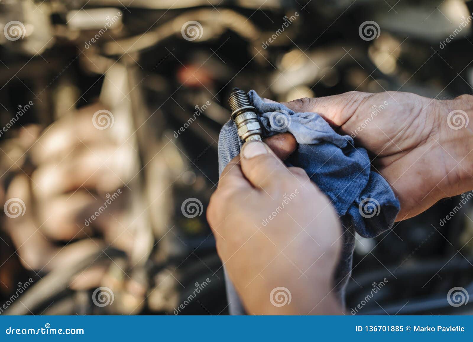 Man checks the spark plug stock image. Image of garage - 136701885