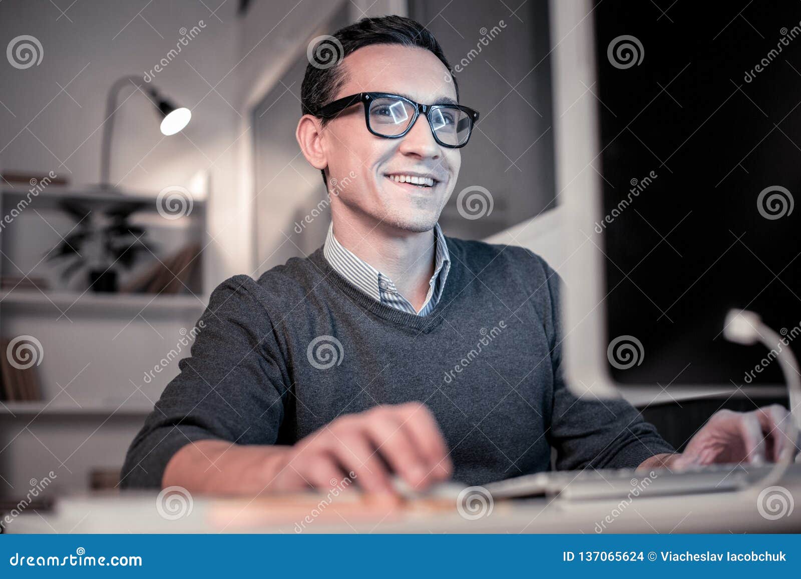 Cheerful Positive Man Looking at the Computer Screen Stock Photo ... Cheerful Positive Man Looking at the Computer Screen Stock Photo ...