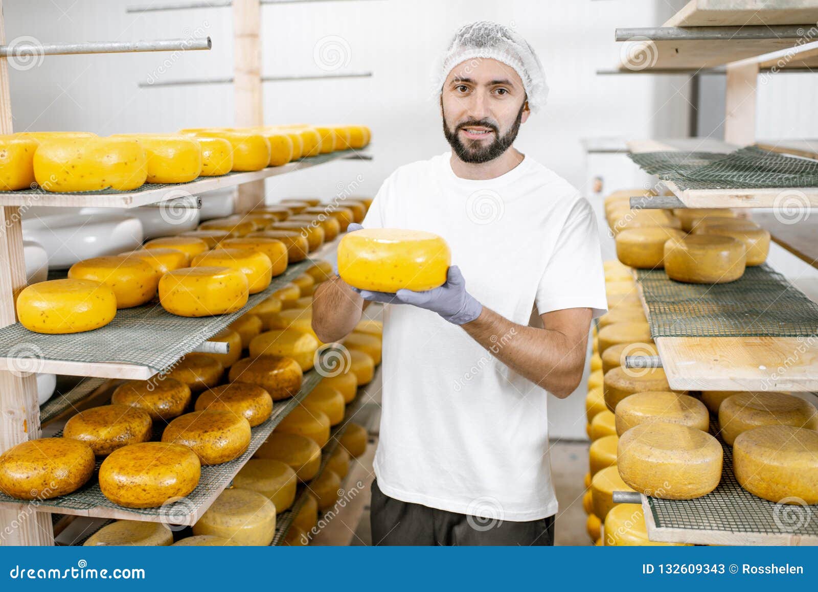 Man with Cheese Wheels at the Storage Stock Image - Image of processing ...