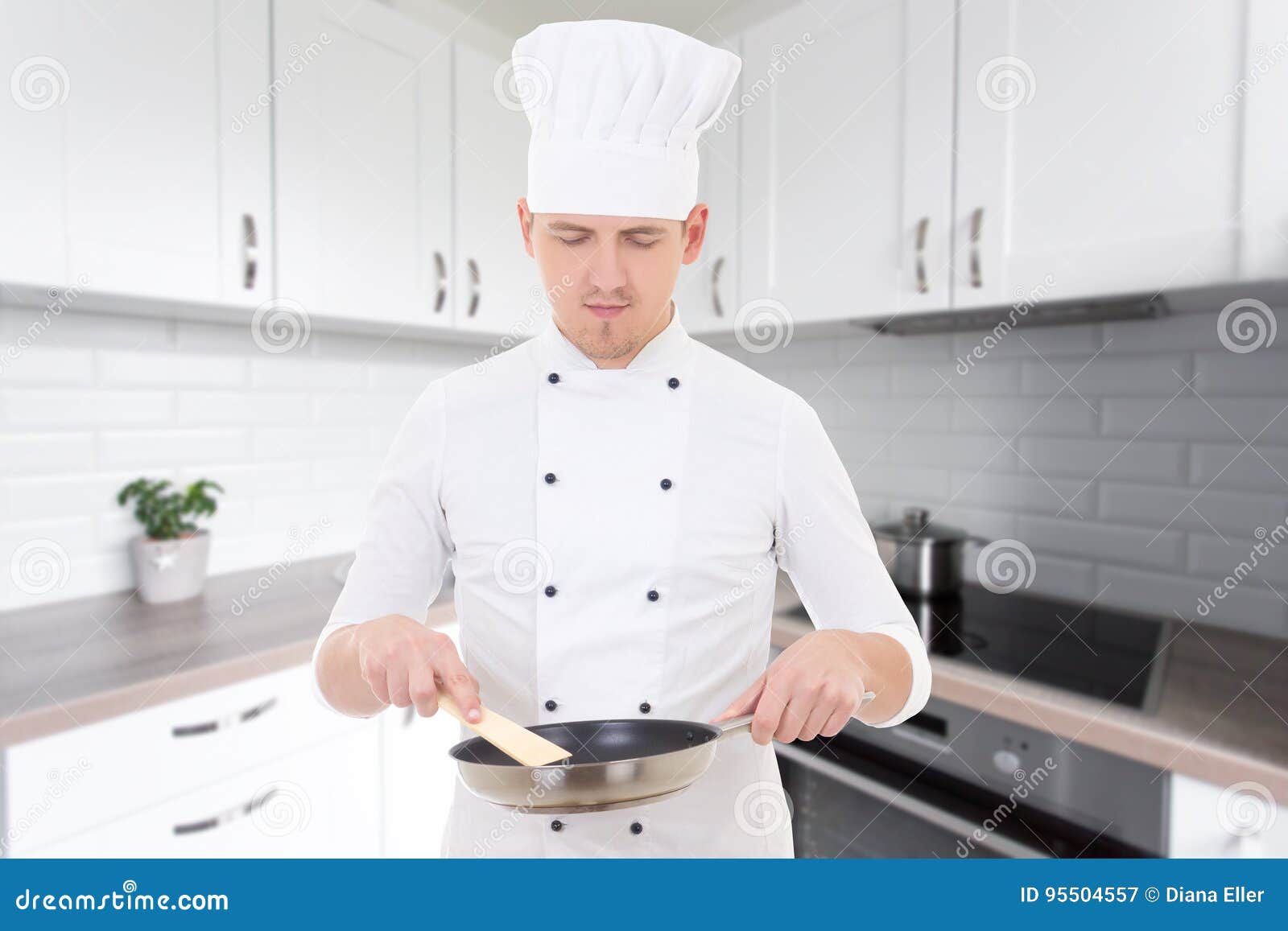 Man Chef in Uniform Holding Frying Pan in Modern Kitchen Stock Image ...