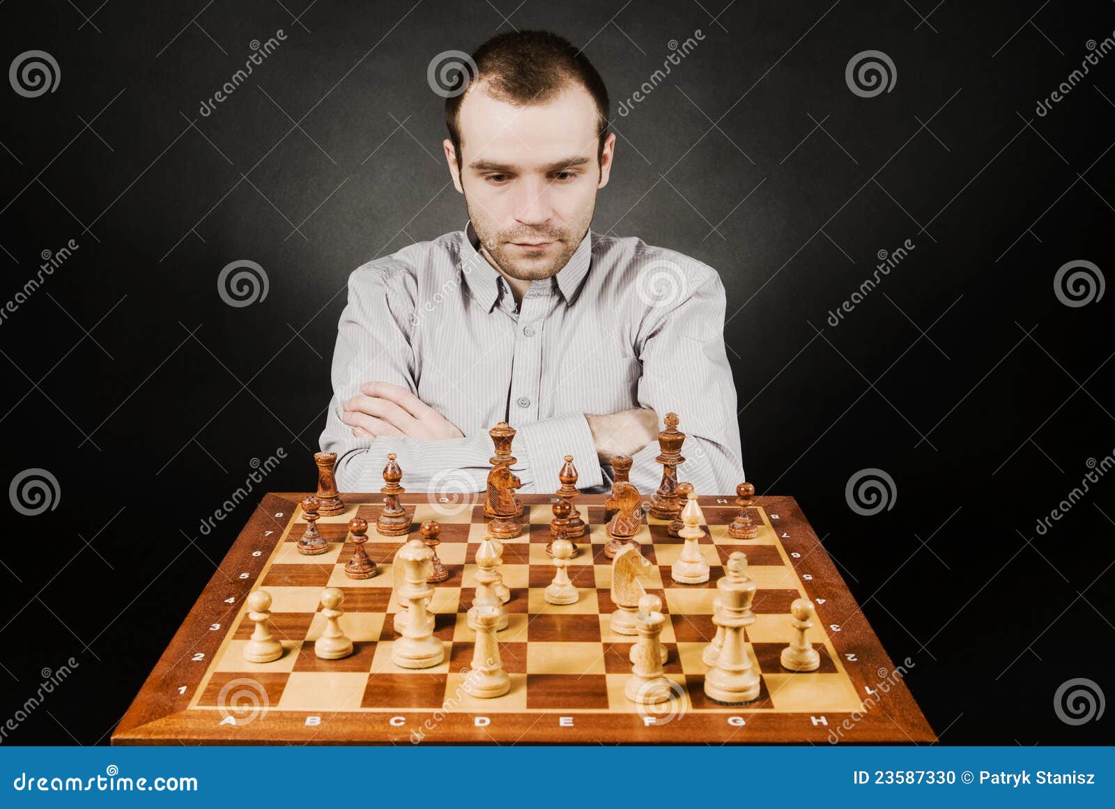 Man at chess board stock photo. Image of hold, pieces - 23587330