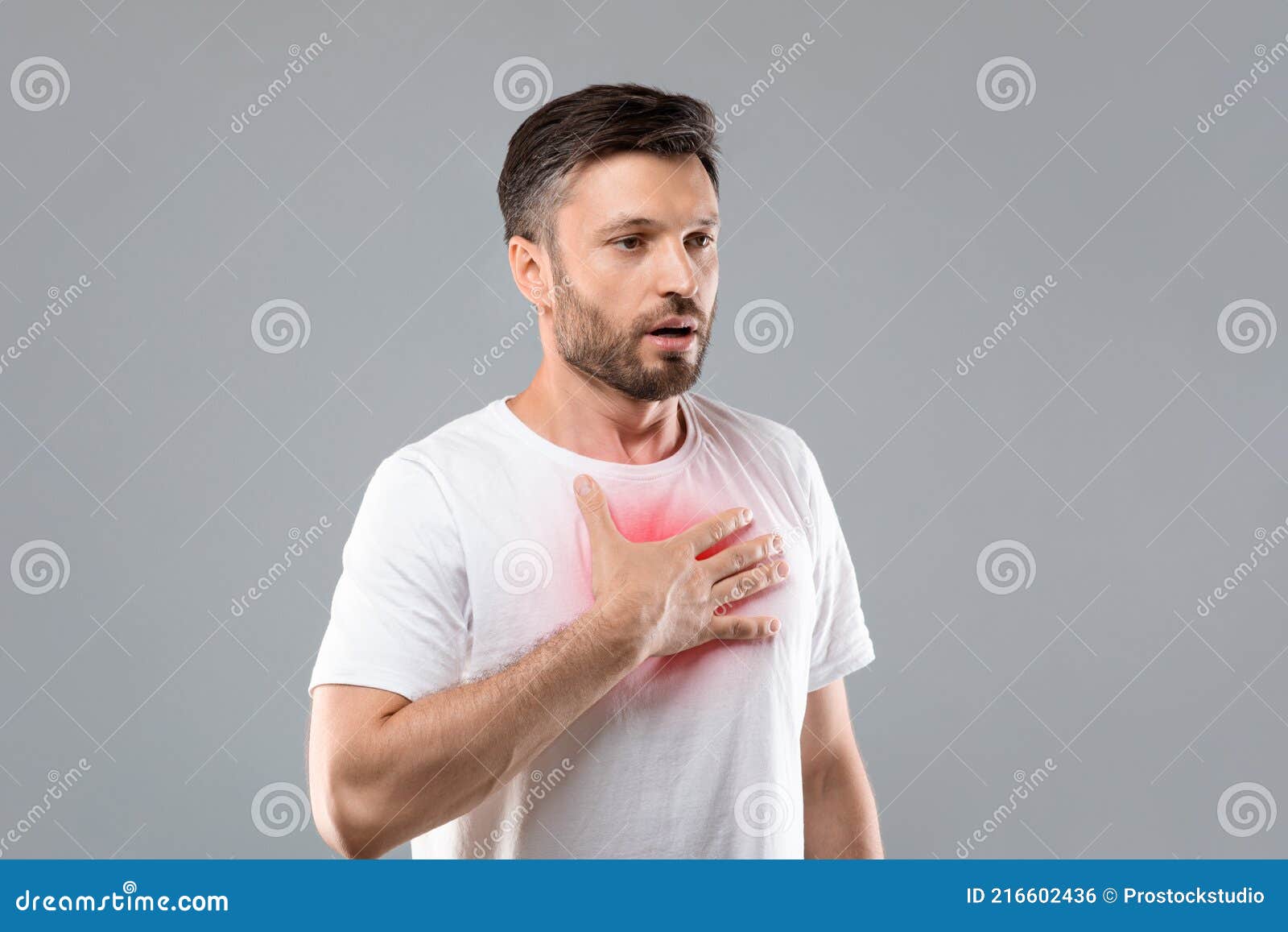 Man with Chest Pain Touching Inflammated Zone, Grey Background Stock ...