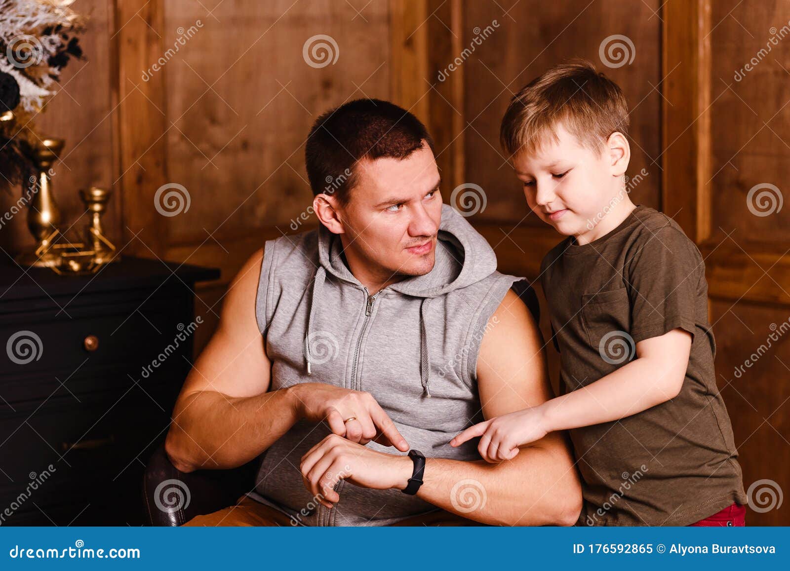 Man and Child Look at the Clock Stock Image - Image of child ...