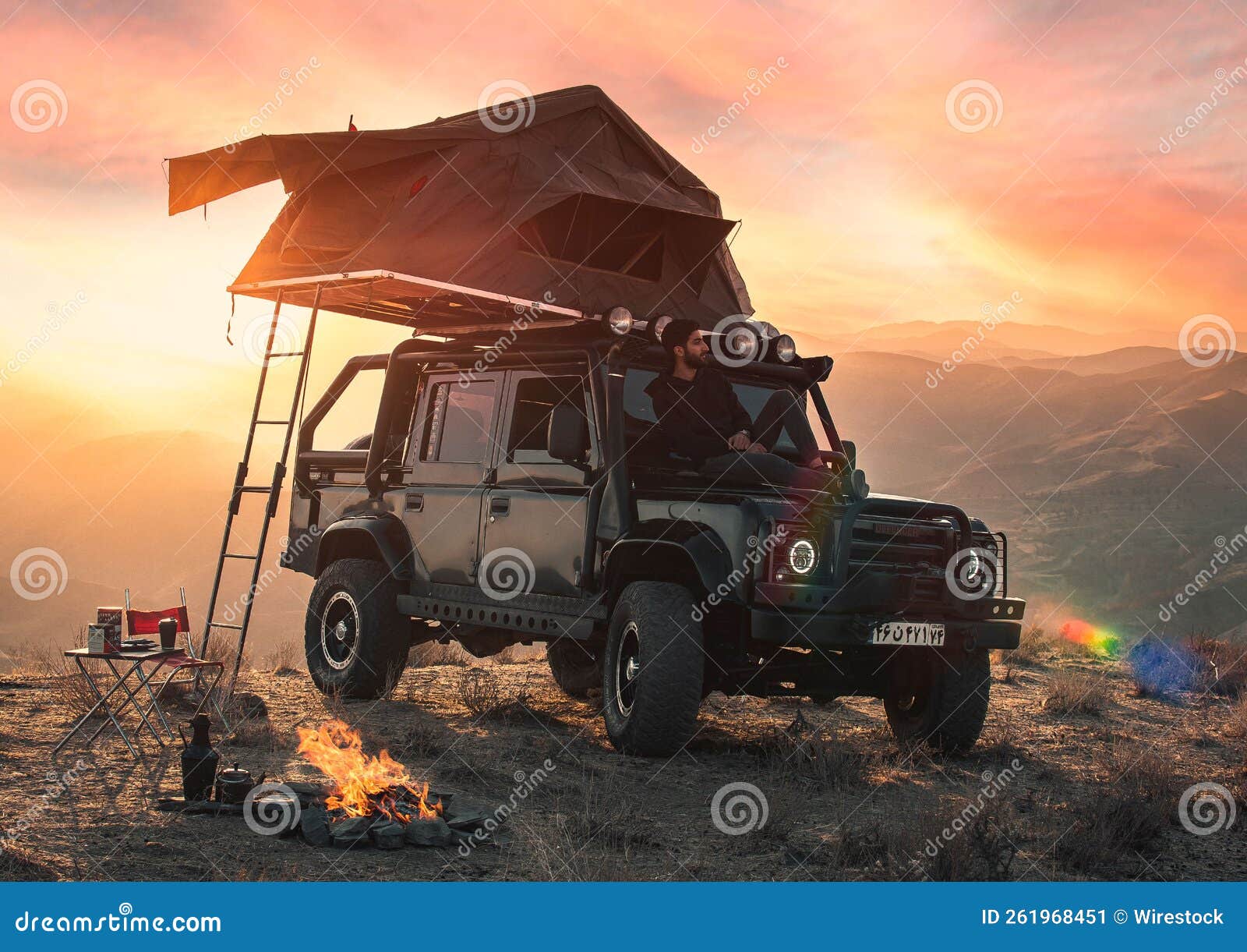 Man Chilling on His Range Rover with the Perfect View of Sunset ...