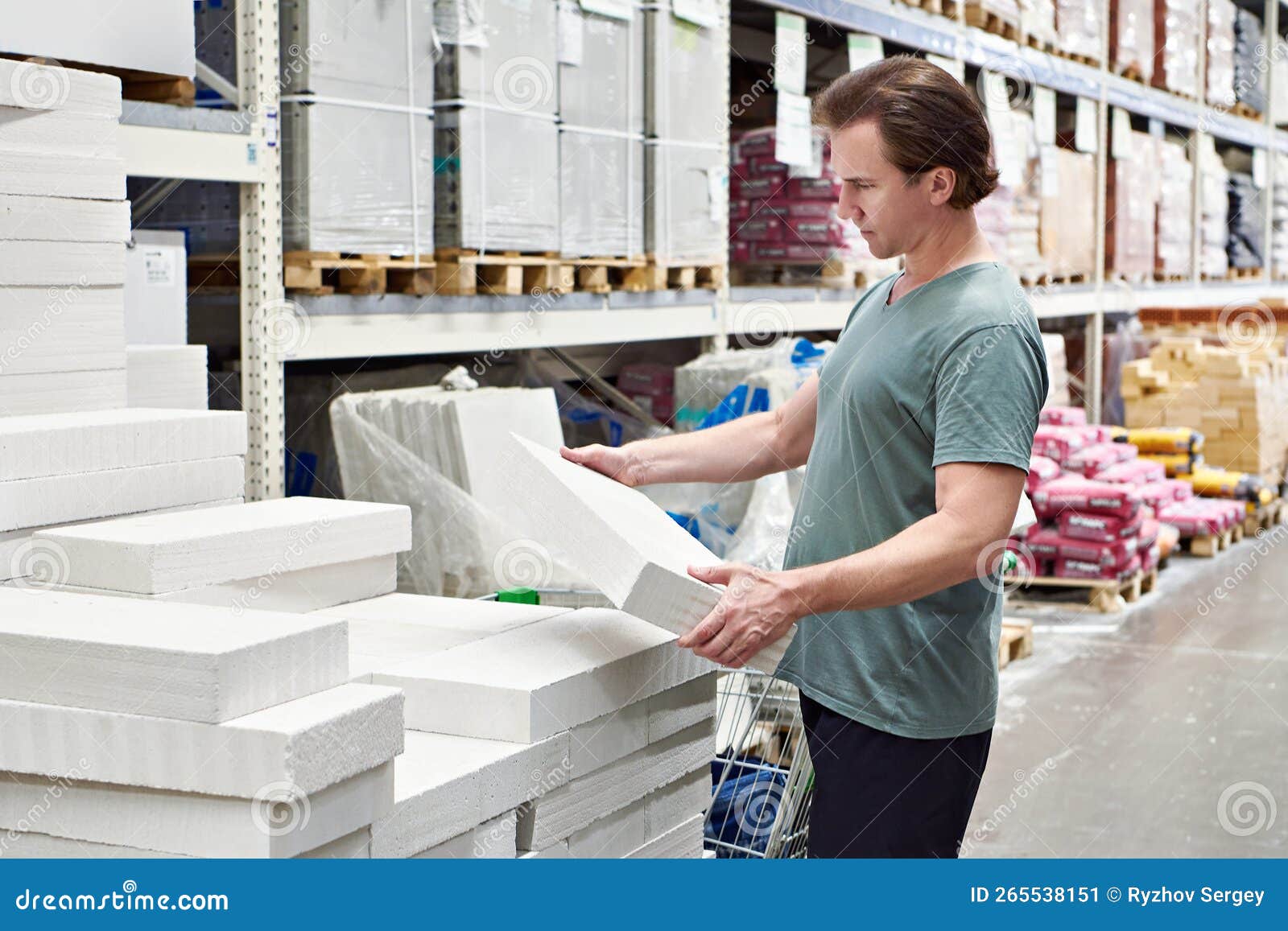 Man Chooses and Buys Foam Concrete Bricks in Store Stock Image - Image ...