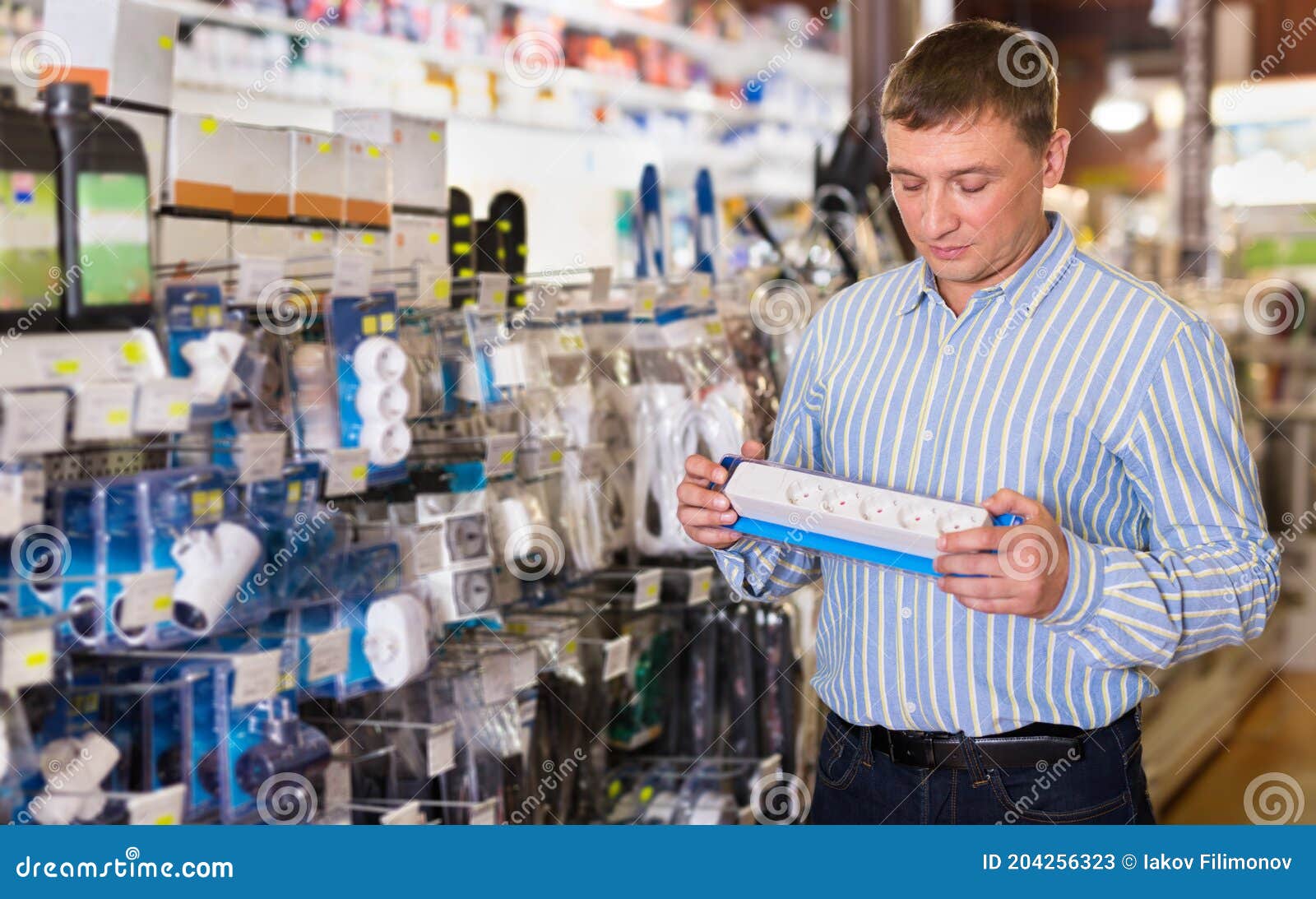 Man Chooses Electrical Parts in Store Stock Image - Image of ...
