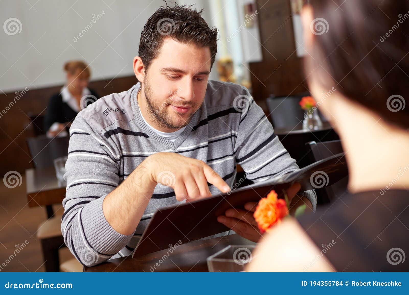 Man Chooses Menu from Menu in Restaurant Stock Photo - Image of menu ...