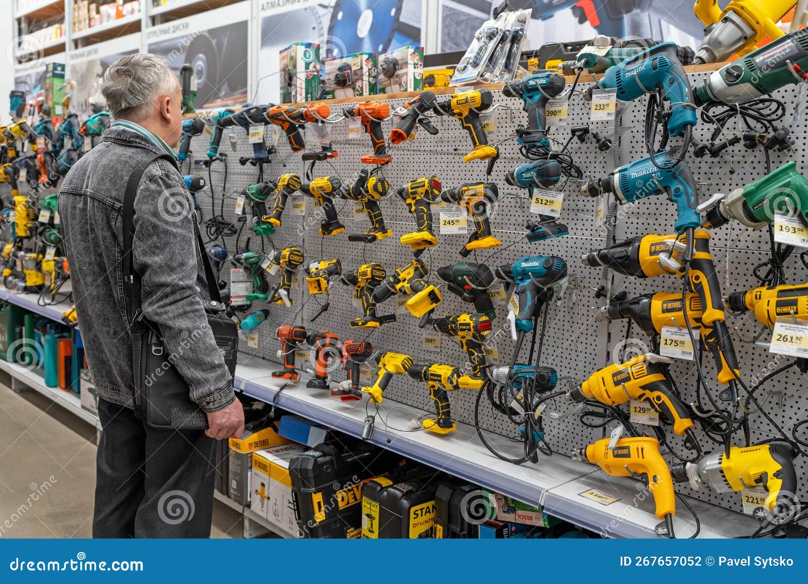 A Man Chooses a Power Tool in a Hardware Store. Minsk, Belarus, 2022 ...