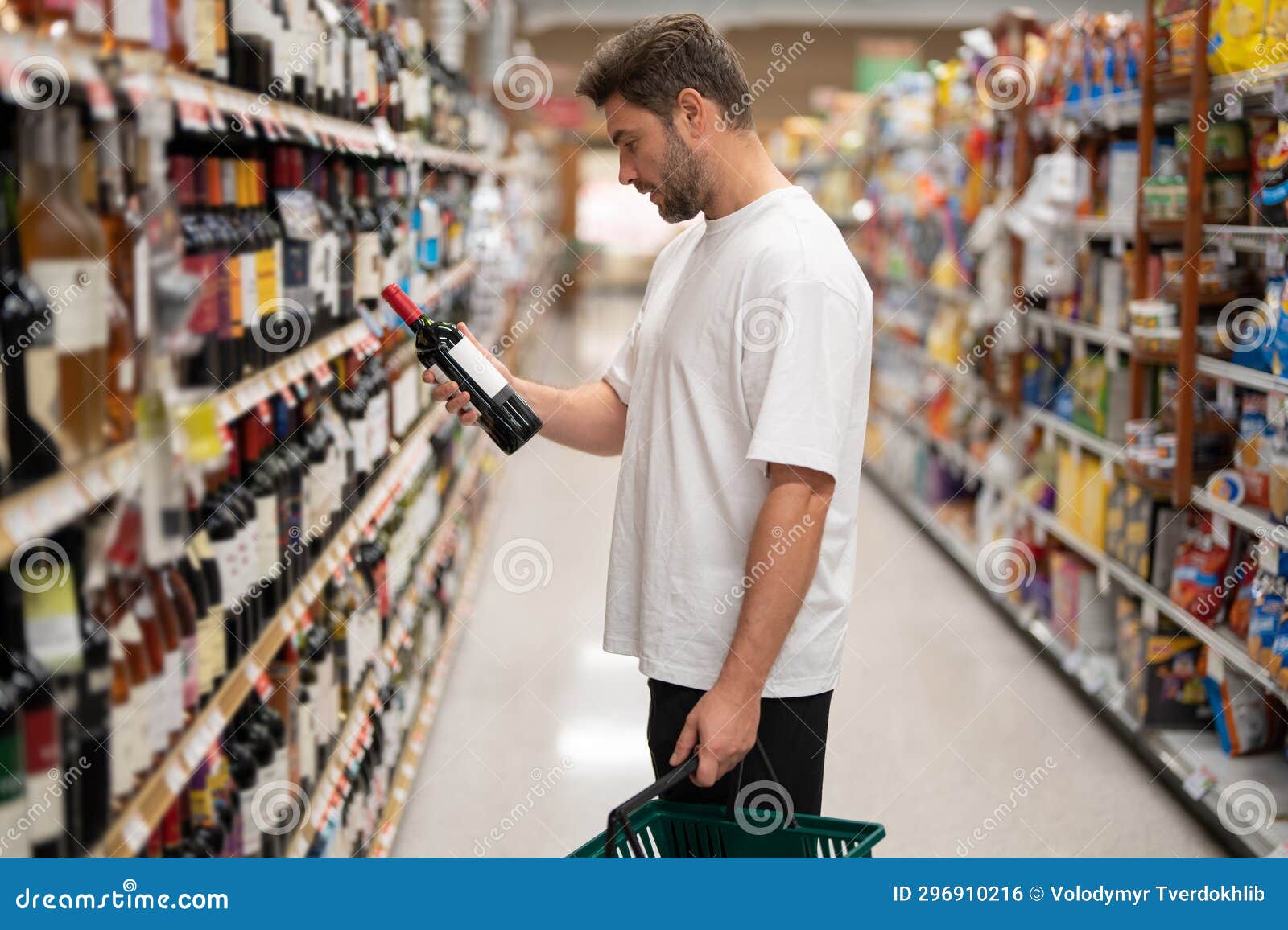 Man Choosing Alcohol Bottles at Liquor Store. Stock Photo - Image of ...