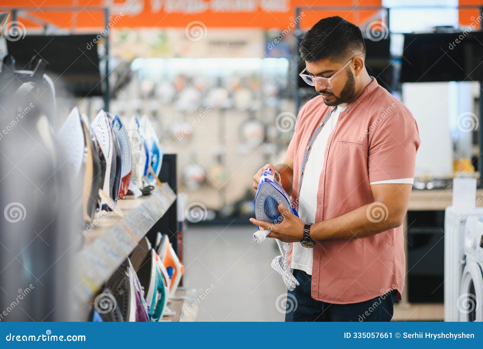 Indian Man Choosing Electric Iron at Store Stock Image - Image of ...
