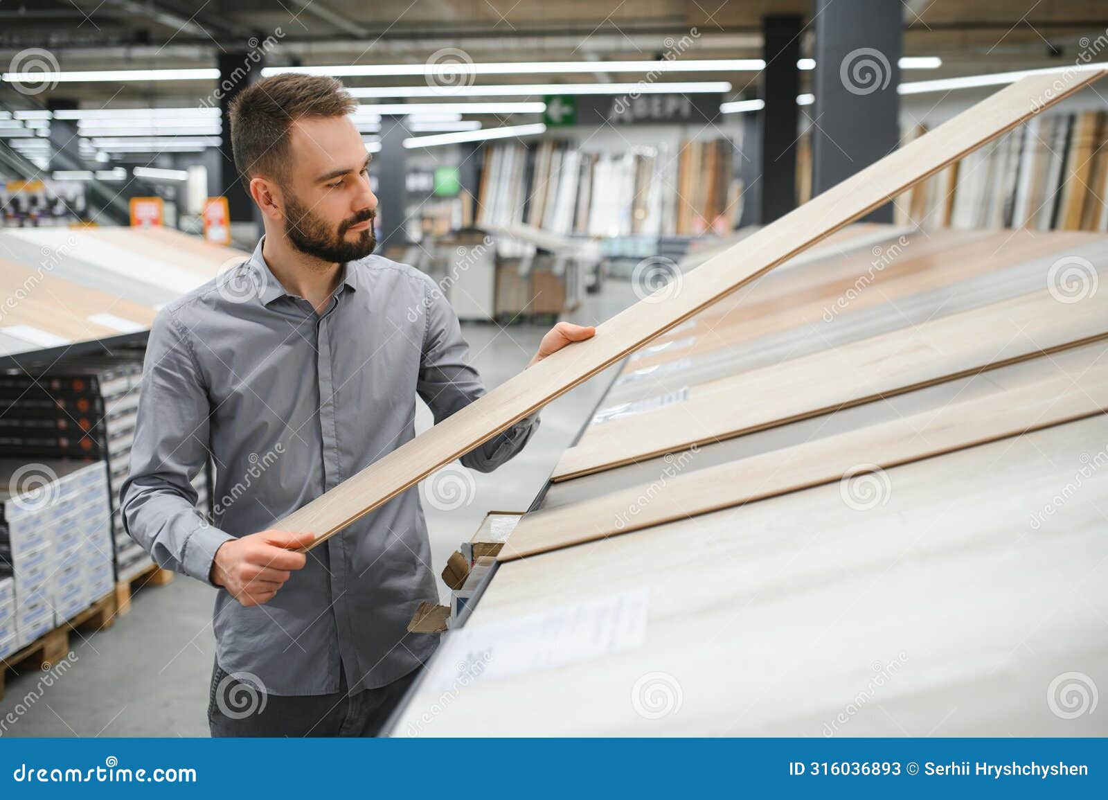 Man Choosing Laminate Samples in Hardware Store Stock Image - Image of ...