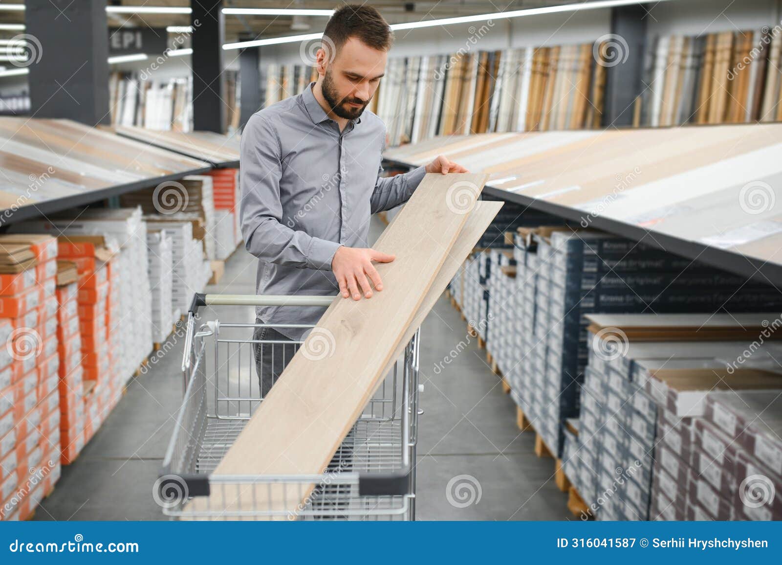 Man Choosing Laminate Samples in Hardware Store Stock Image - Image of ...