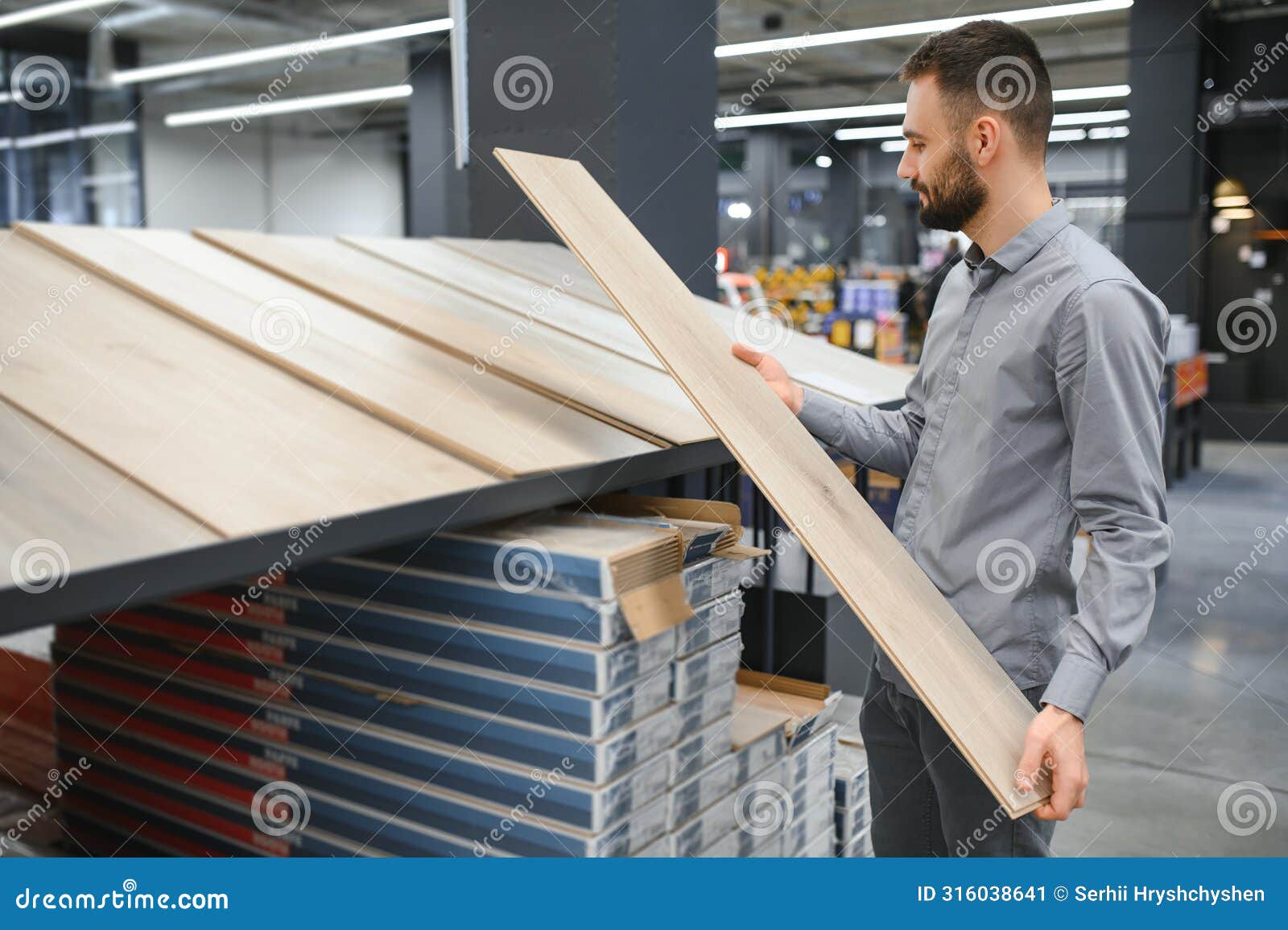 Man Choosing Laminate Samples in Hardware Store Stock Image - Image of ...