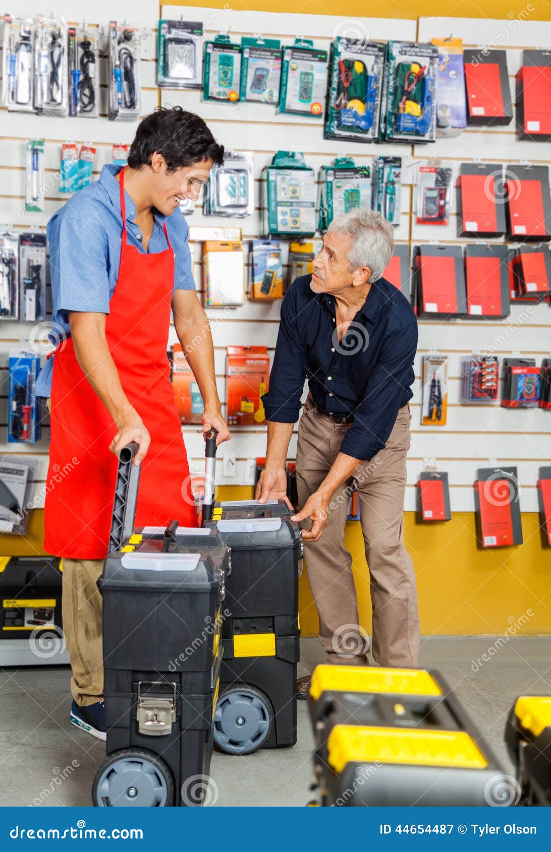 Man Choosing Tool Cases while Salesman Assisting Stock Image - Image of ...