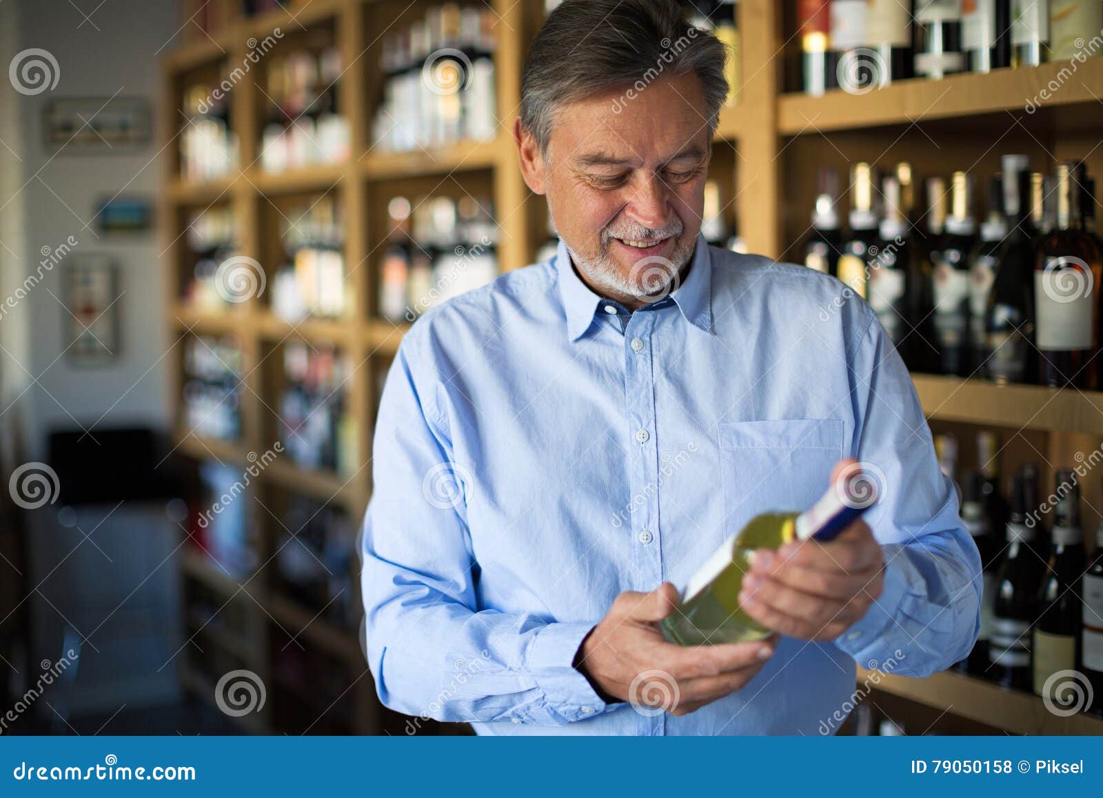 Man choosing wine stock photo. Image of adult, inventory - 79050158