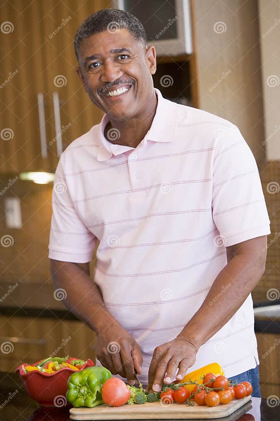 Man Chopping Vegetables stock photo. Image of cutting - 6880650