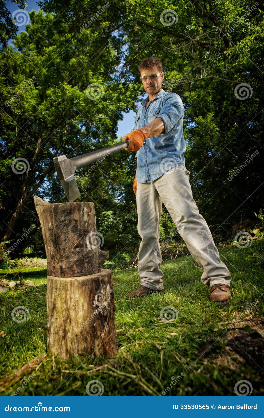 Man chopping wood vertical stock image. Image of forest - 33530565