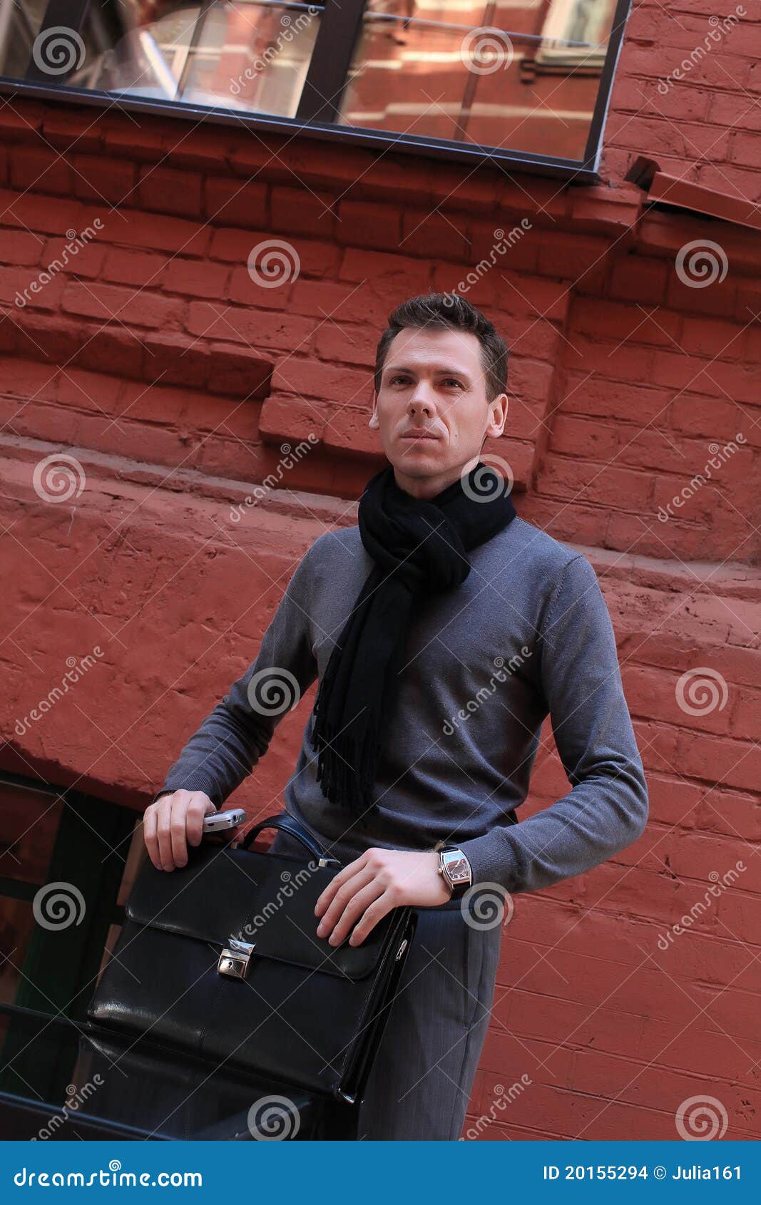 Man with case in city stock photo. Image of sweater, phone - 20155294