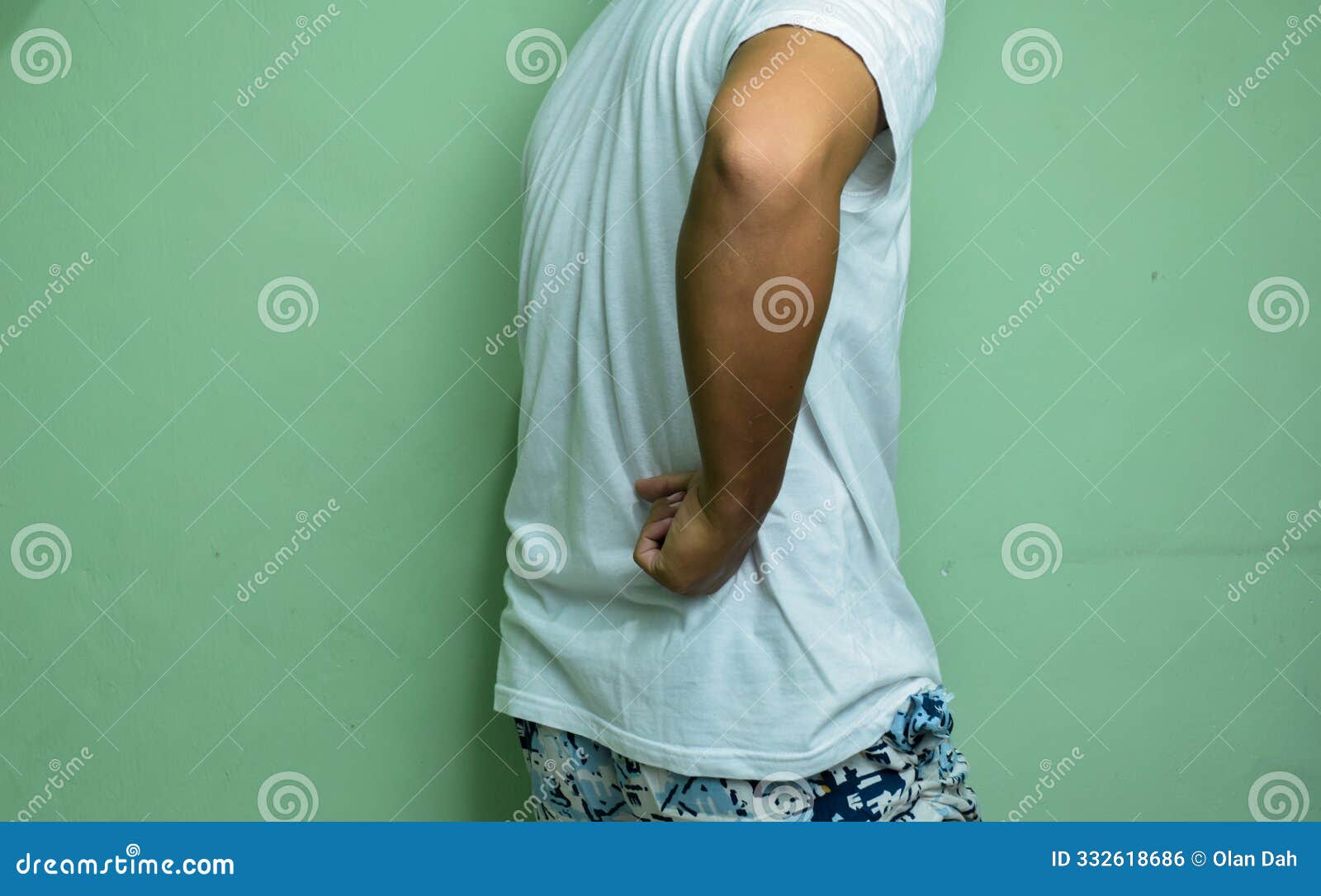 A Man Clapping His Back with His Fist Stock Photo - Image of hand, fist ...