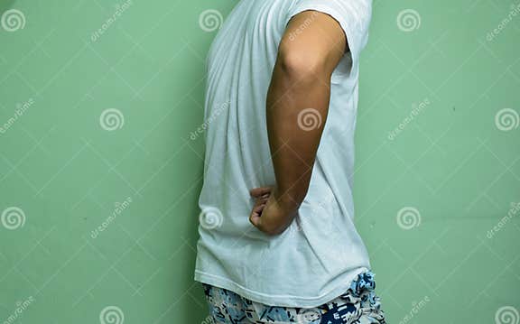 A Man Clapping His Back with His Fist Stock Photo - Image of hand, fist ...