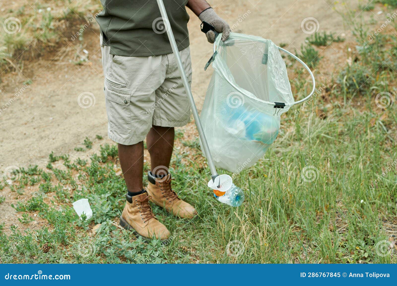Man Cleaning the Environment from Garbage Stock Image - Image of green ...