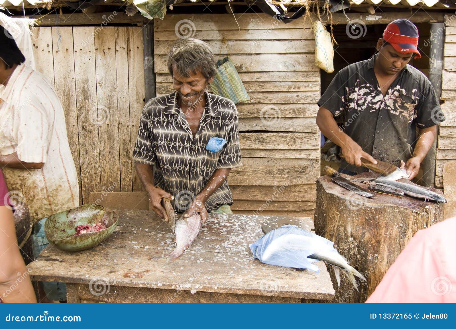 Man cleaning the fish editorial image. Image of commercial - 13372165