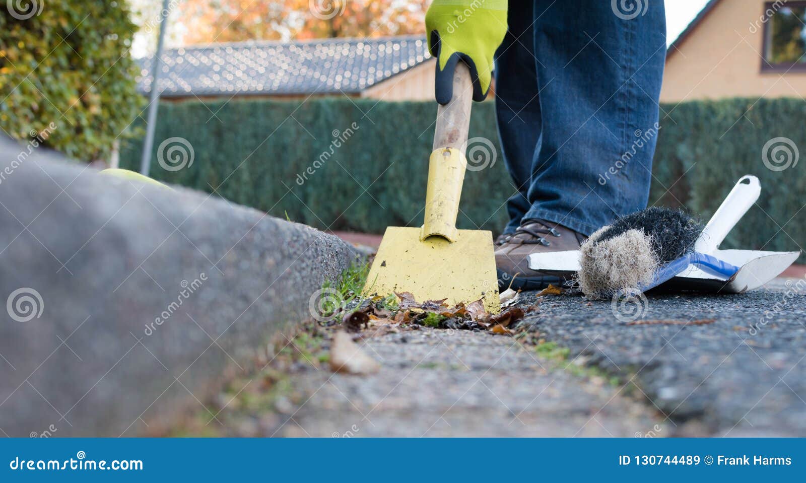Man is cleaning the gutter stock image. Image of ground - 130744489