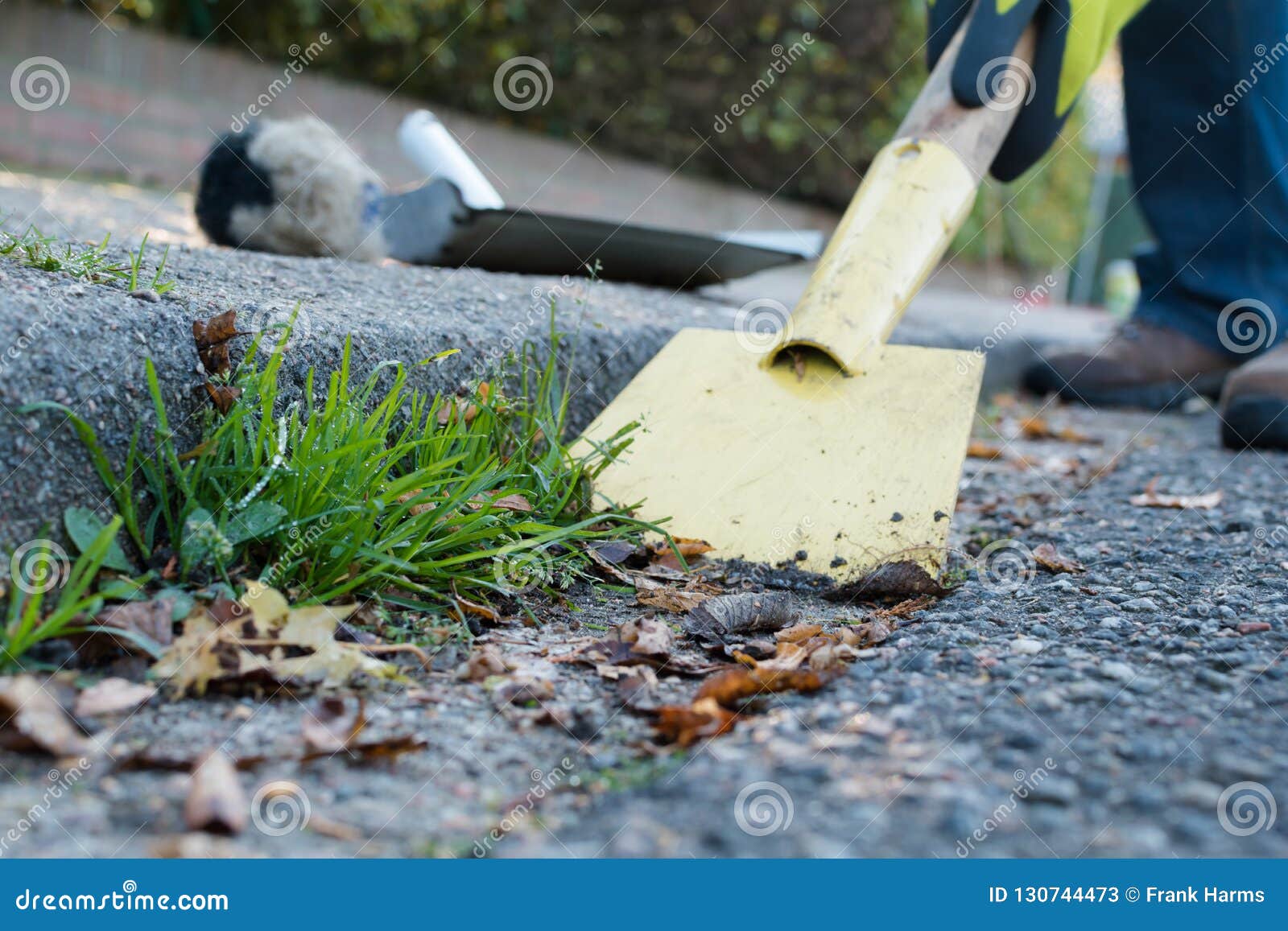 Man is cleaning the gutter stock image. Image of ground - 130744473