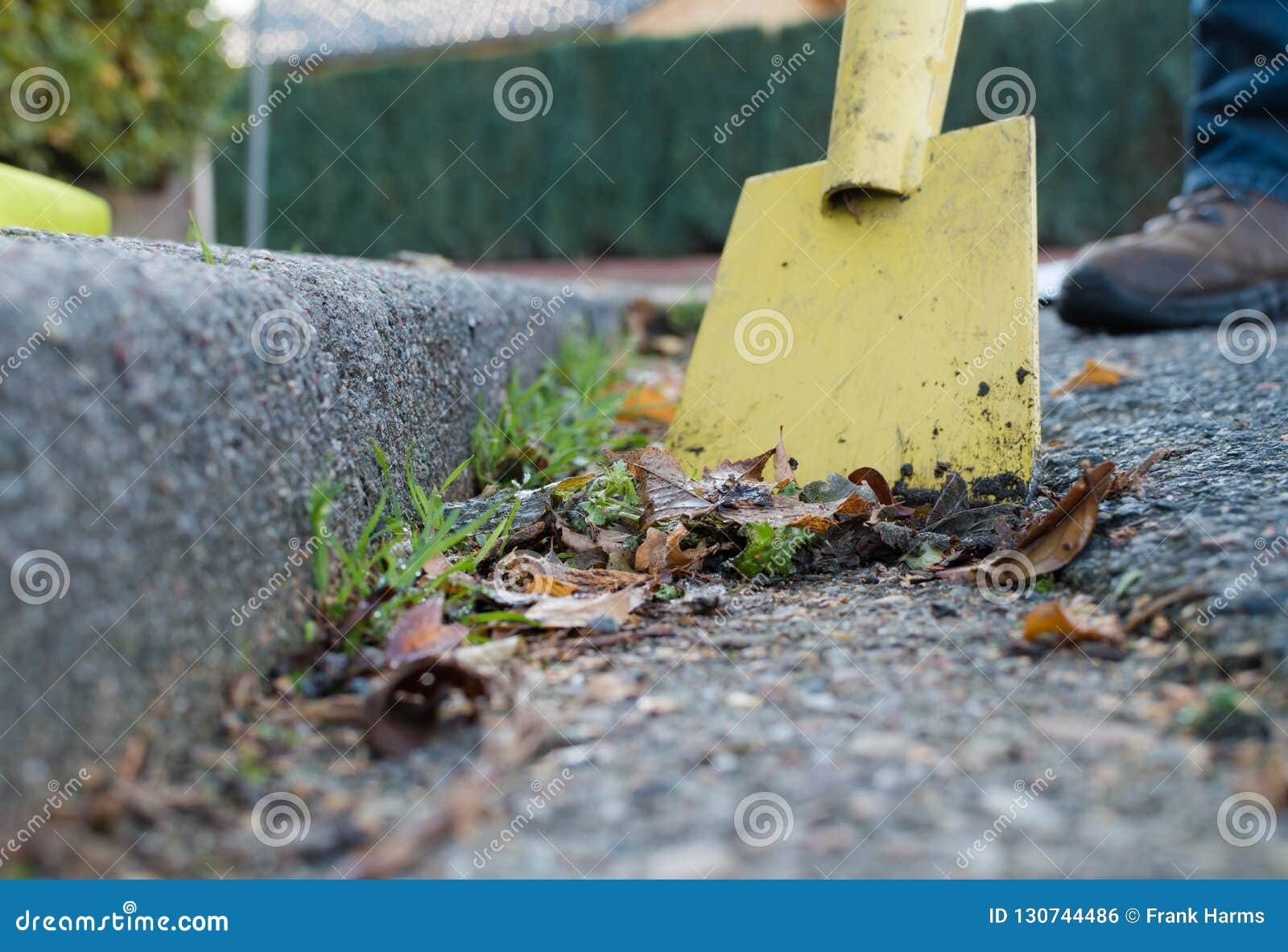 Man is cleaning the gutter stock photo. Image of concrete - 130744486