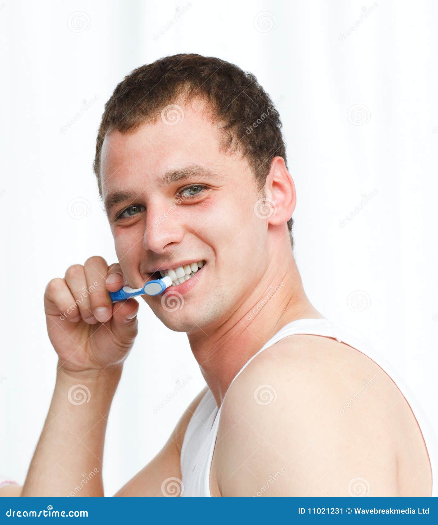 Man Cleaning His Teeth Smiling Stock Image - Image of handsome, perfect ...