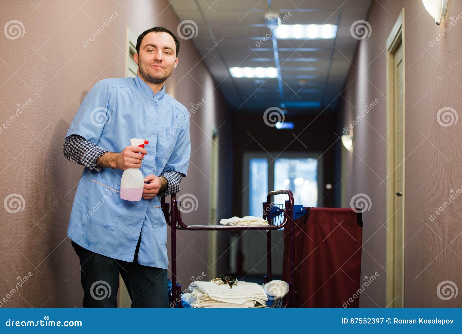 Man Cleaning Hotel Hall Wearing Blue Coat Stock Image - Image of gloves ...