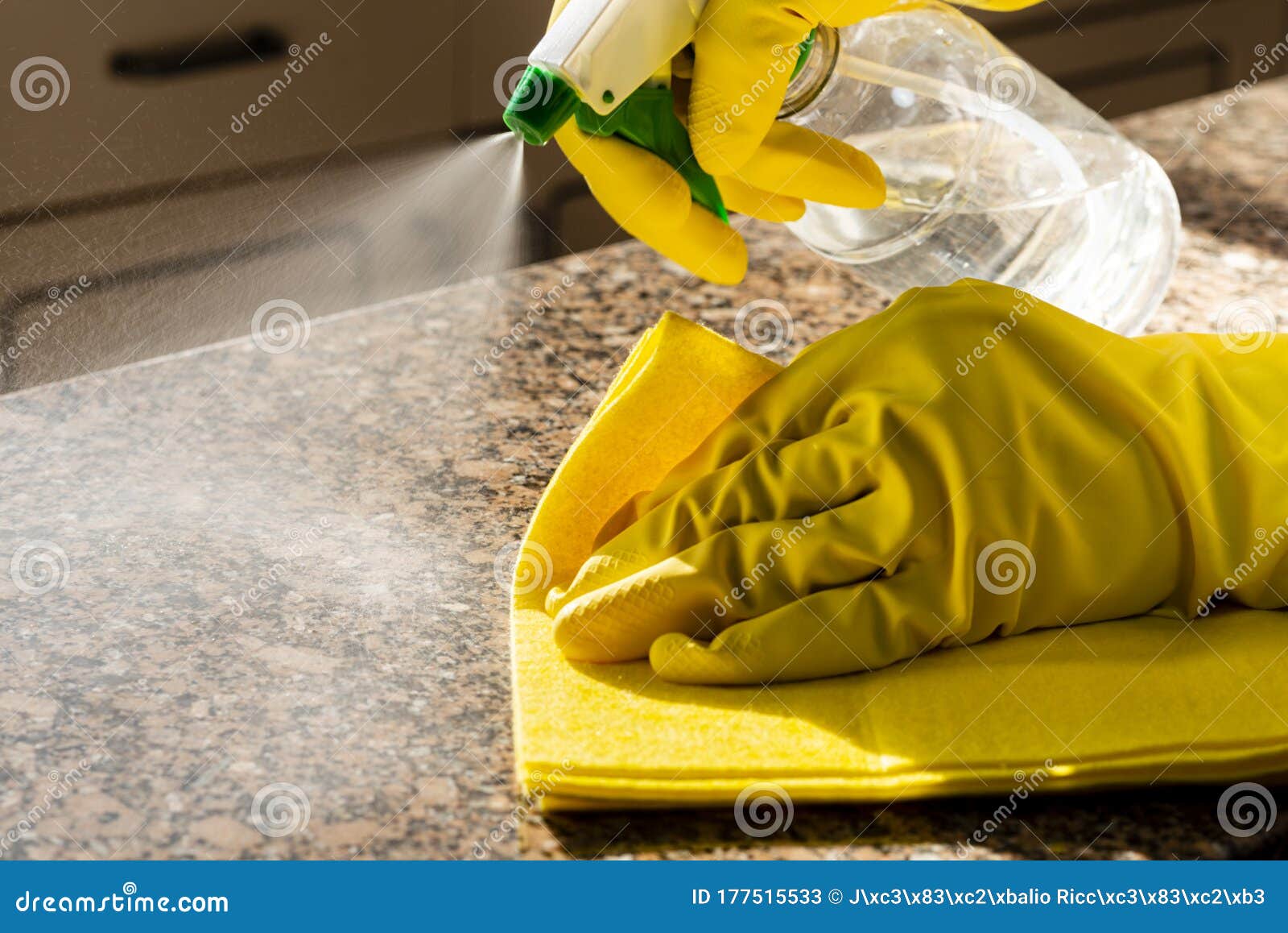 Man Cleaning Kitchen Counter with Solution To Kill Viruses and Bacteria ...