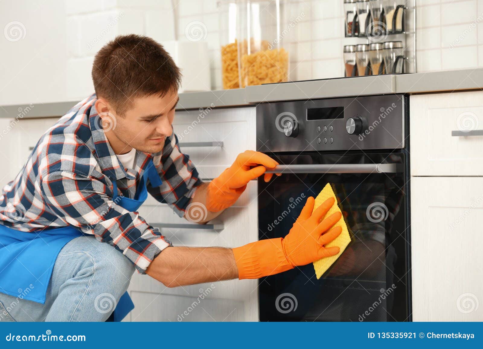 Man Cleaning Kitchen Oven with Rag Stock Image - Image of housework ...