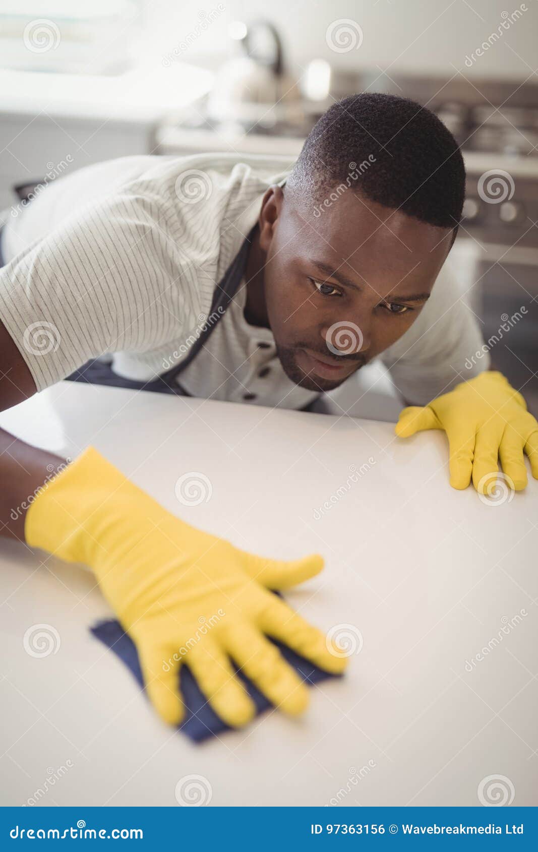 Man Cleaning the Kitchen Worktop Stock Photo - Image of apartment ...