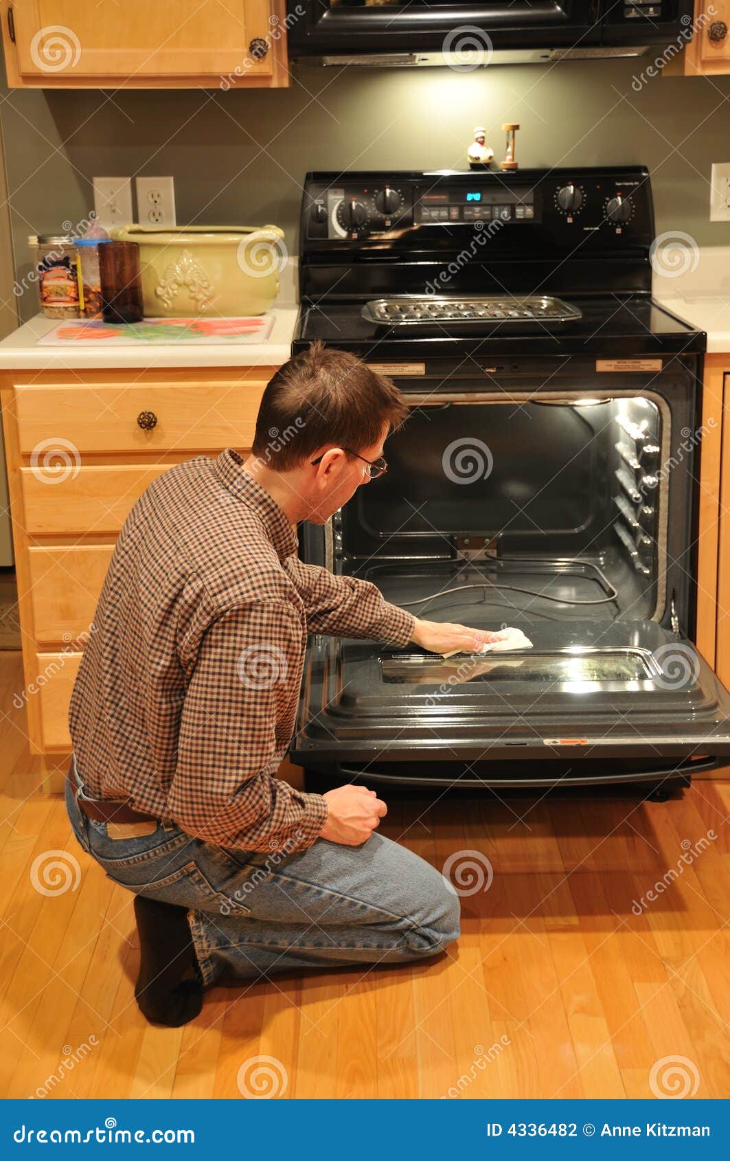 Man Cleaning Oven stock photo. Image of oven, business - 4336482