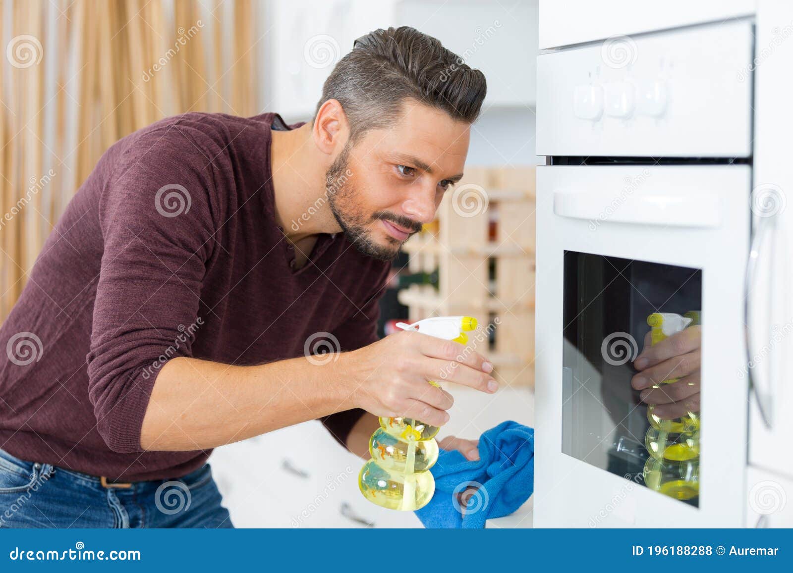 Man Cleaning Oven in Kitchen Stock Photo - Image of indoors, cuisine ...