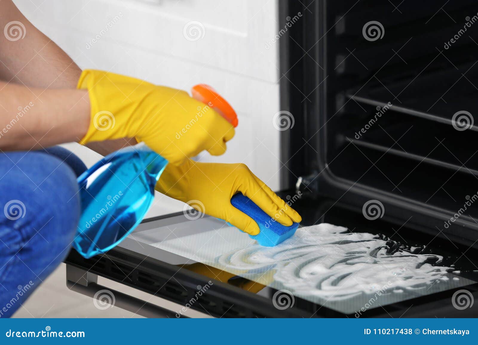 Man Cleaning Oven in Kitchen, Stock Photo - Image of cooker, indoors ...